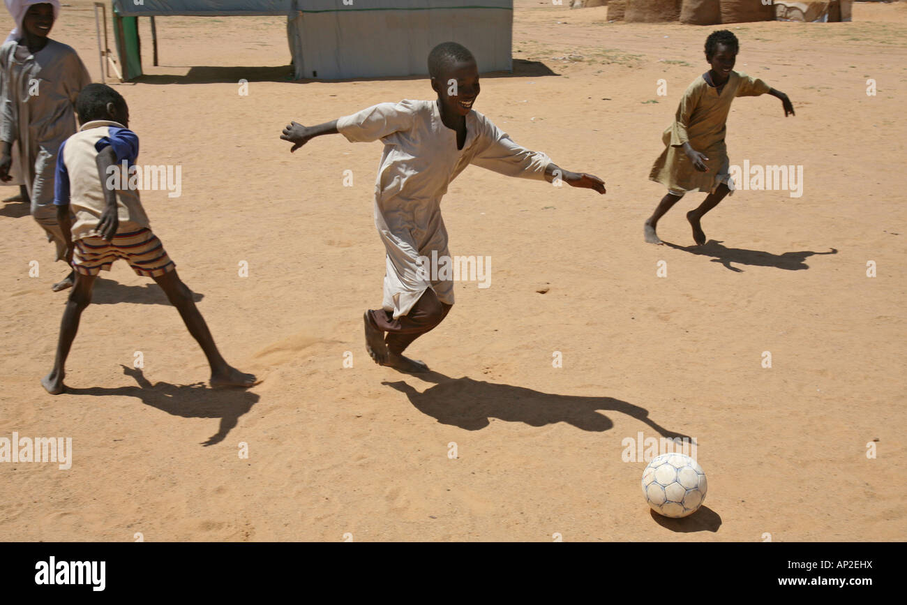 Refugee children playing football Stock Photo - Alamy