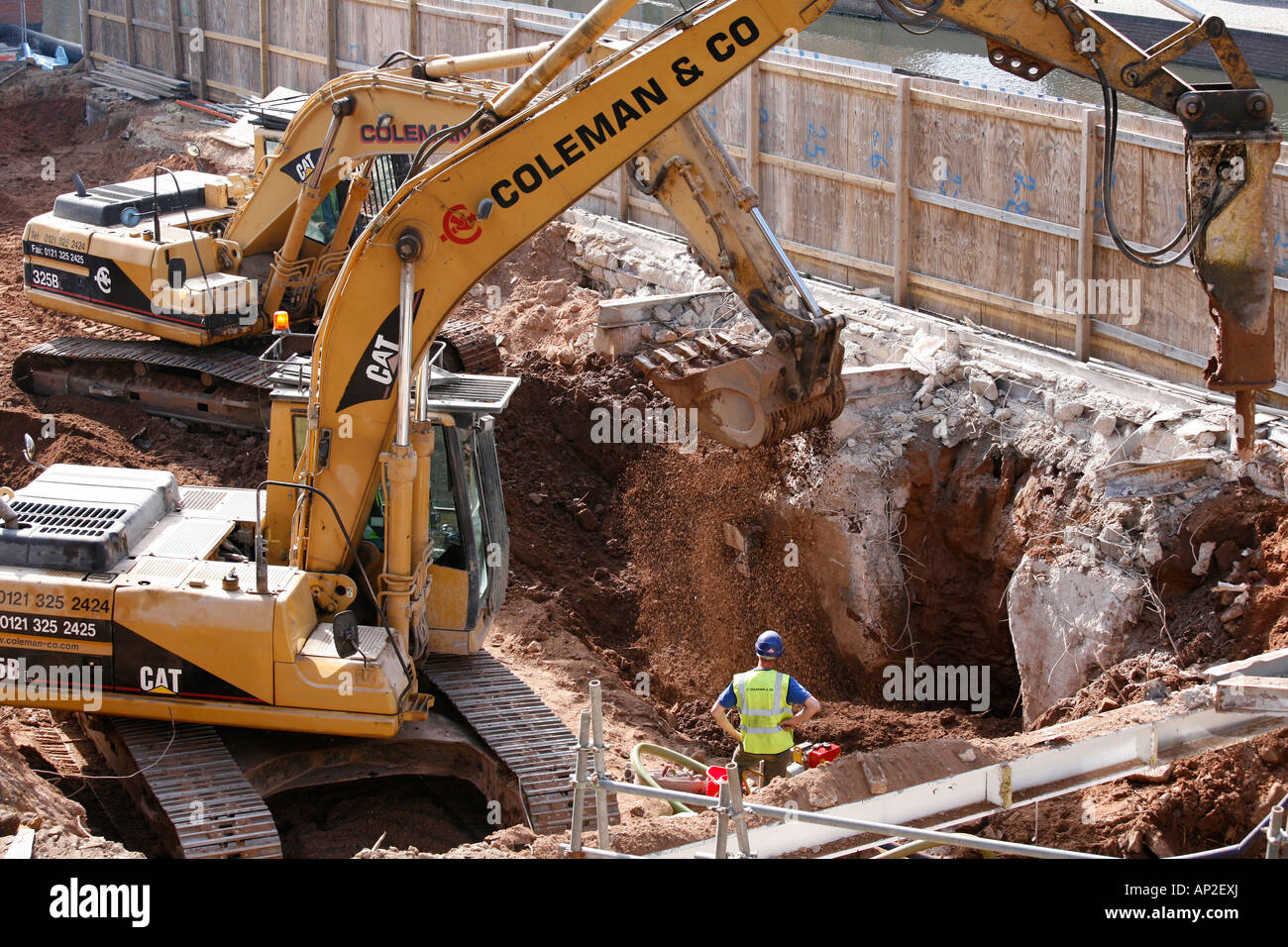 Construction work taking place on building site Stock Photo - Alamy
