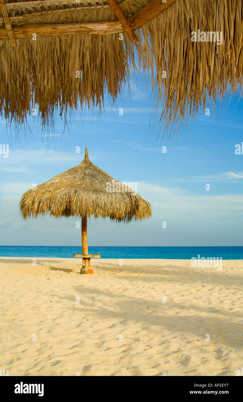 Under a palapa on Beach; Aruba Stock Photo - Alamy