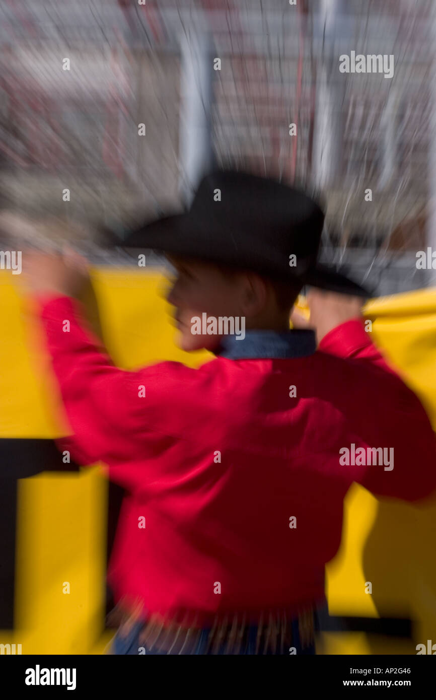 Zoomed close ups of young cowboys fans at the Tucson Rodeo competition ...
