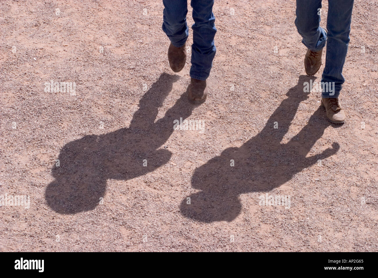 Shadows of Cowboy in full dress and gear before the Tucson Rodeo ...