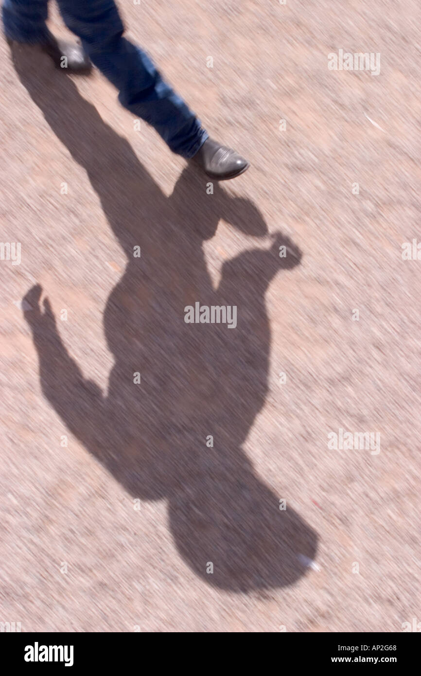 Shadows of Cowboy in full dress and gear before the Tucson Rodeo ...