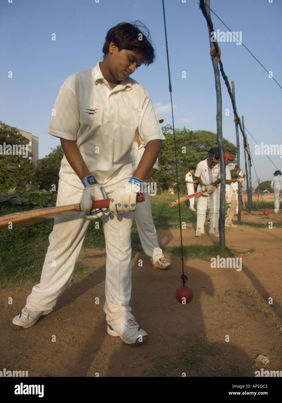Indian youth practice cricket Stock Photo - Alamy