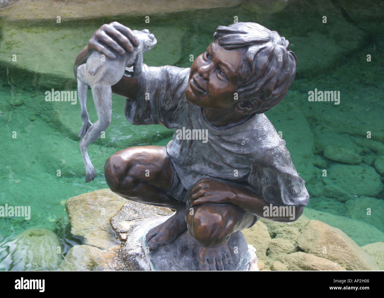 Bronze statue of boy with frog Sedona Arizona Stock Photo - Alamy