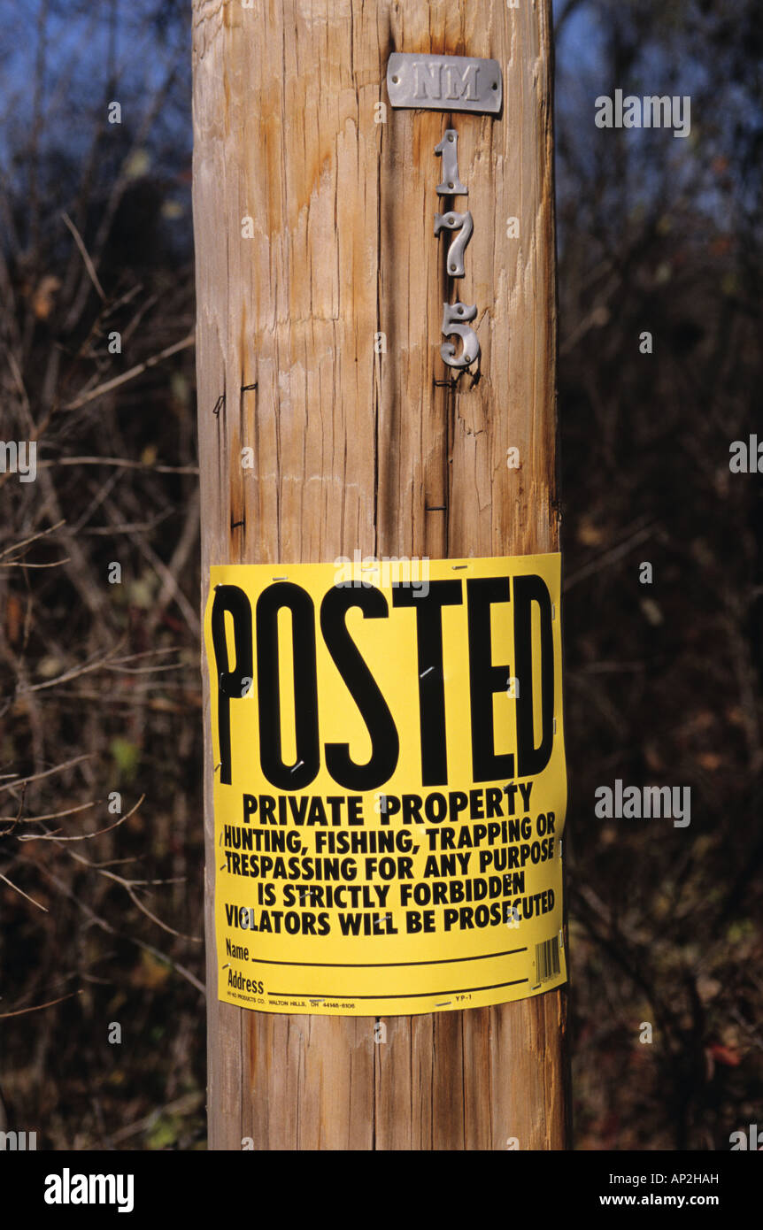 Posted sign on utility pole Stock Photo - Alamy