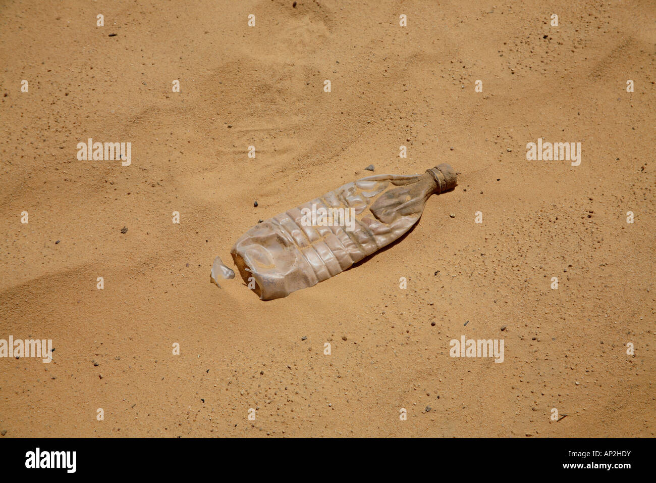 Broken bottle in the desert Stock Photo - Alamy