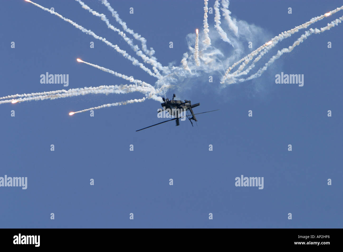 Apache AH64D helicopter performing acrobatics at an air display and ...