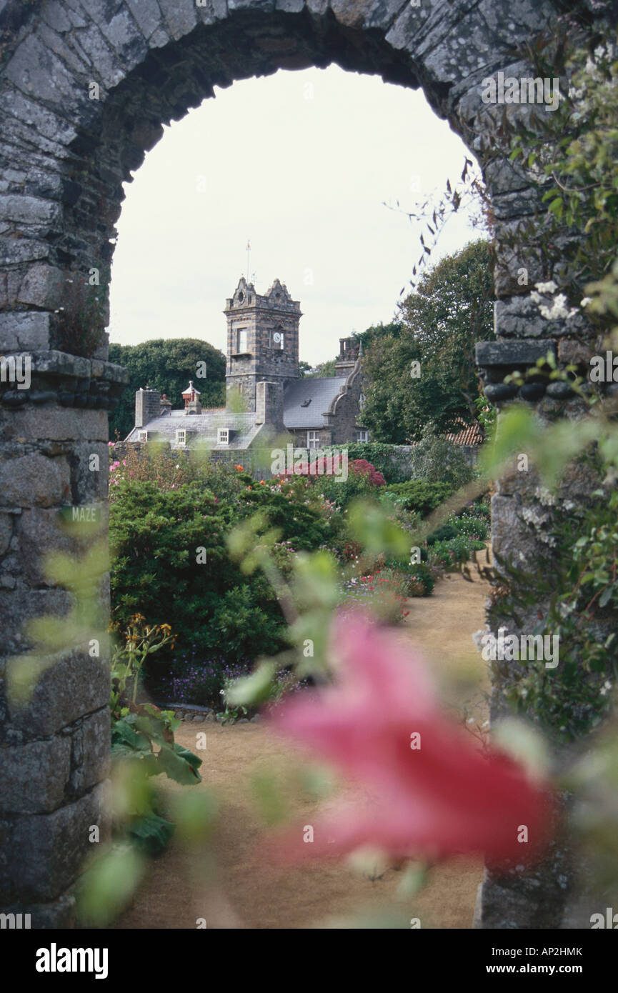 The Seigneurie Garden with view through an arch towards a church, Sark ...