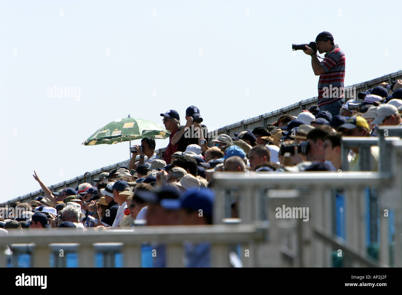Audience with grandstand seats photographers taking photographs of the ...