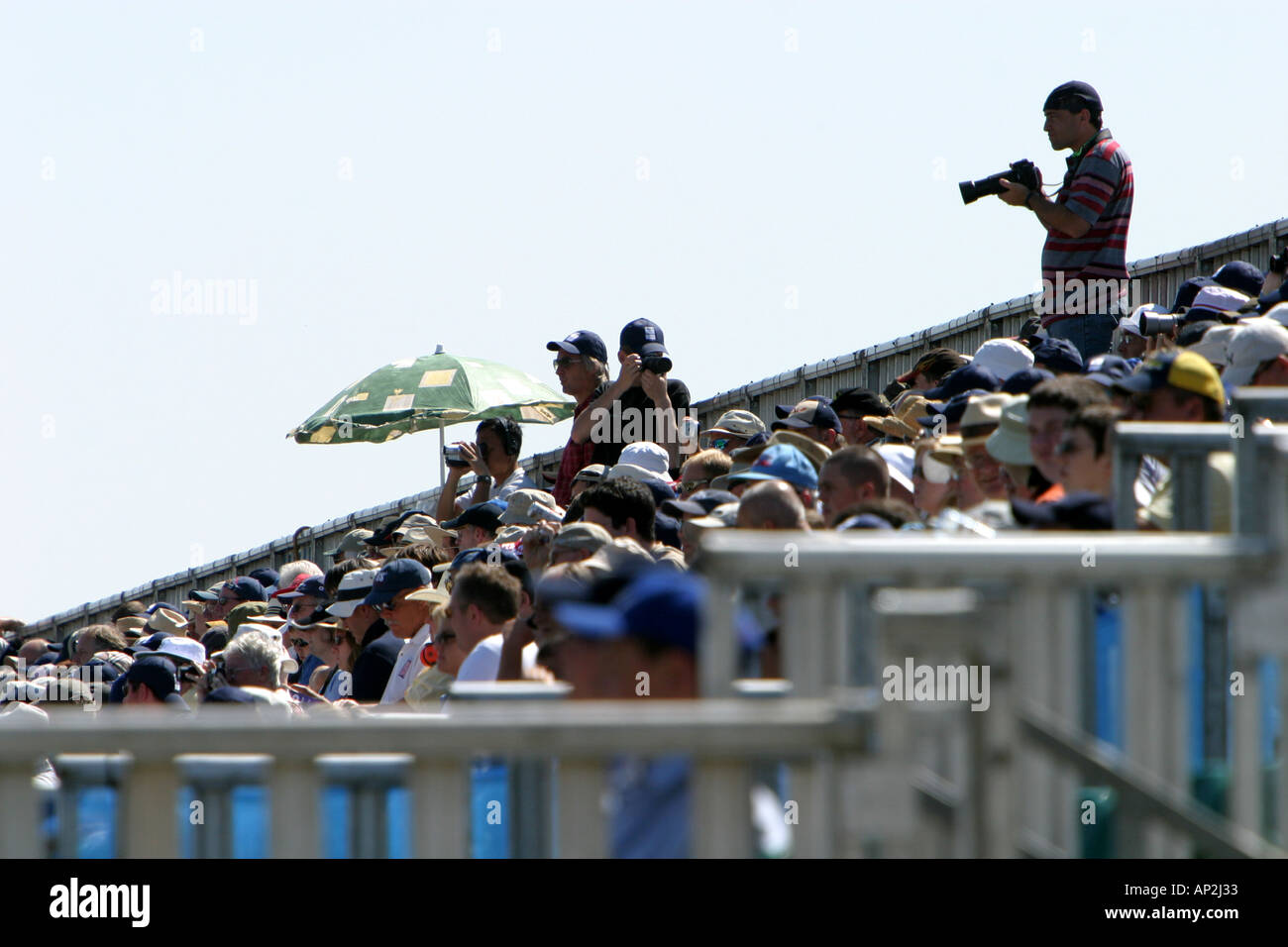 Audience with grandstand seats photographers taking photographs of the ...