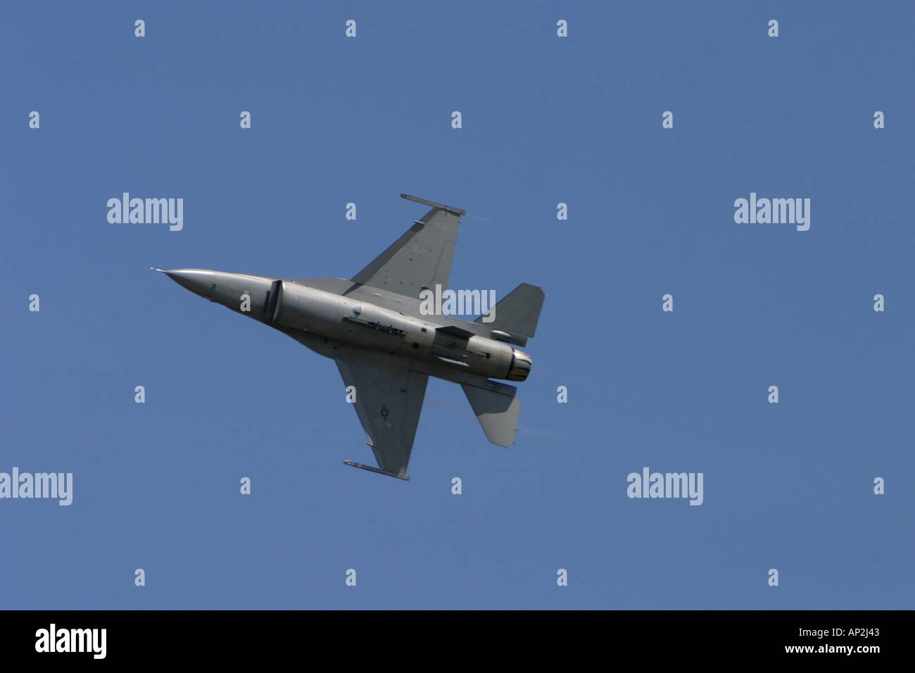 F16 military fighter jet performing an acrobatic display Stock Photo ...