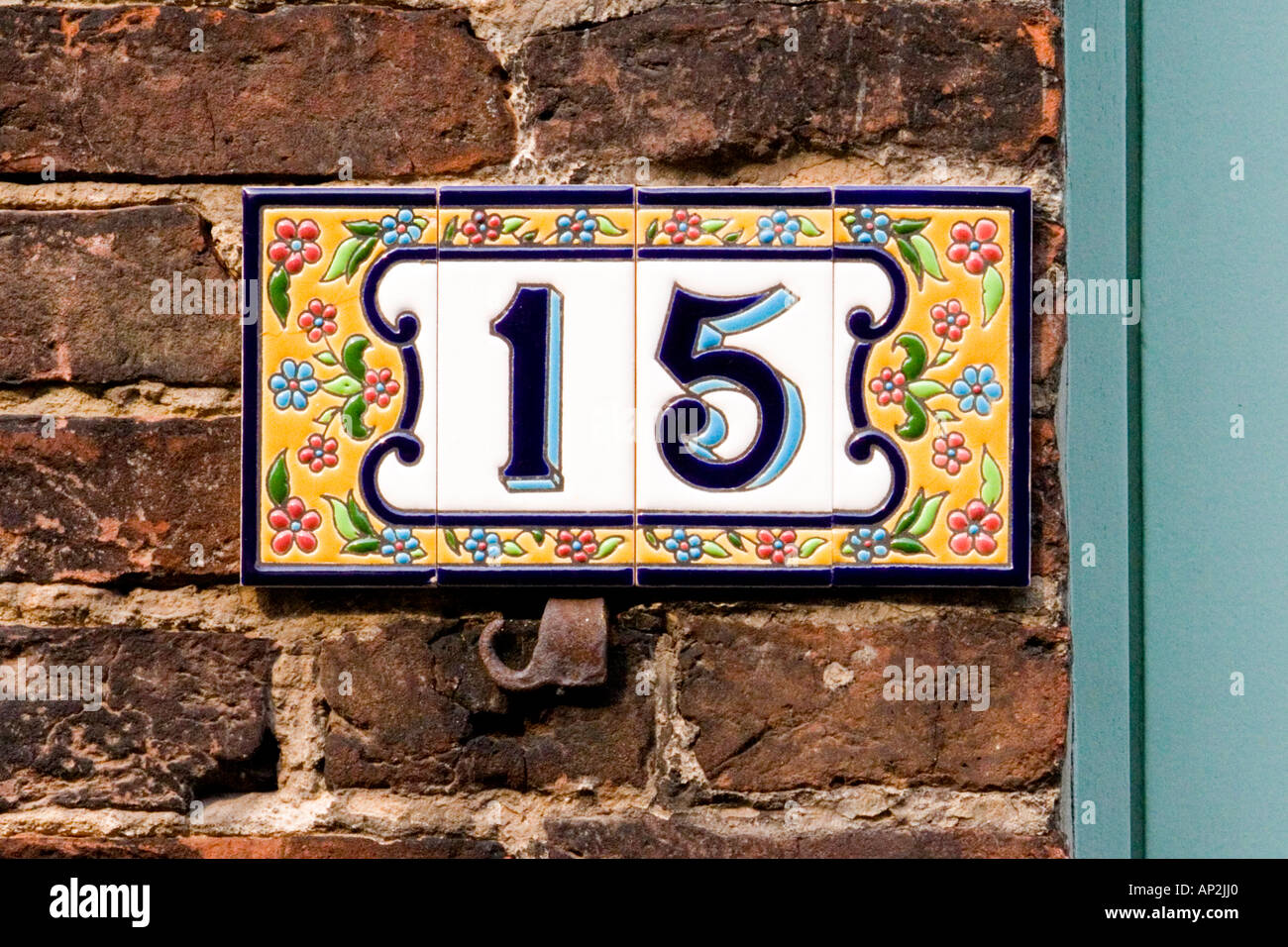 Colourful ceramic house number sign Stock Photo - Alamy