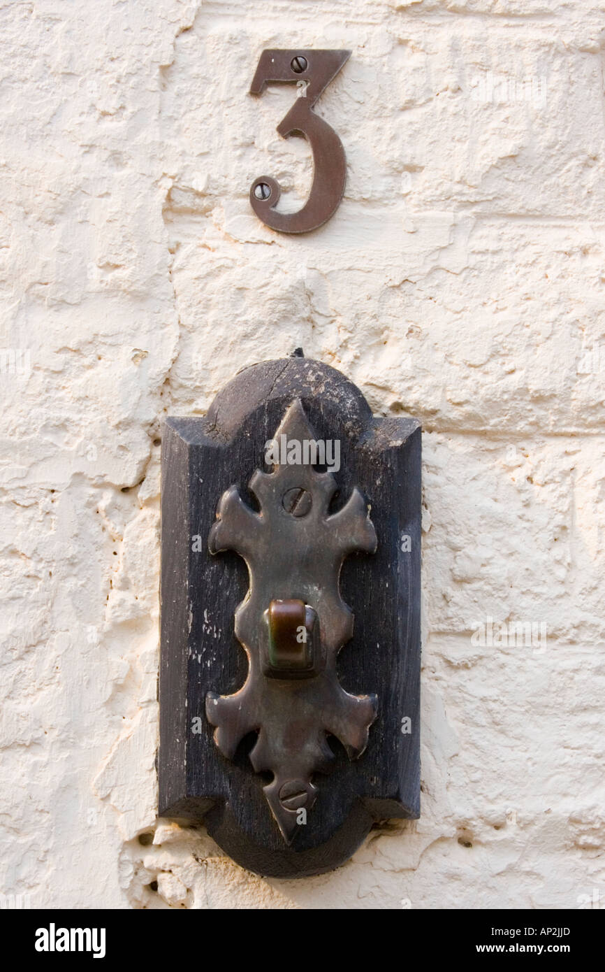 House number sign above doorbell Stock Photo - Alamy