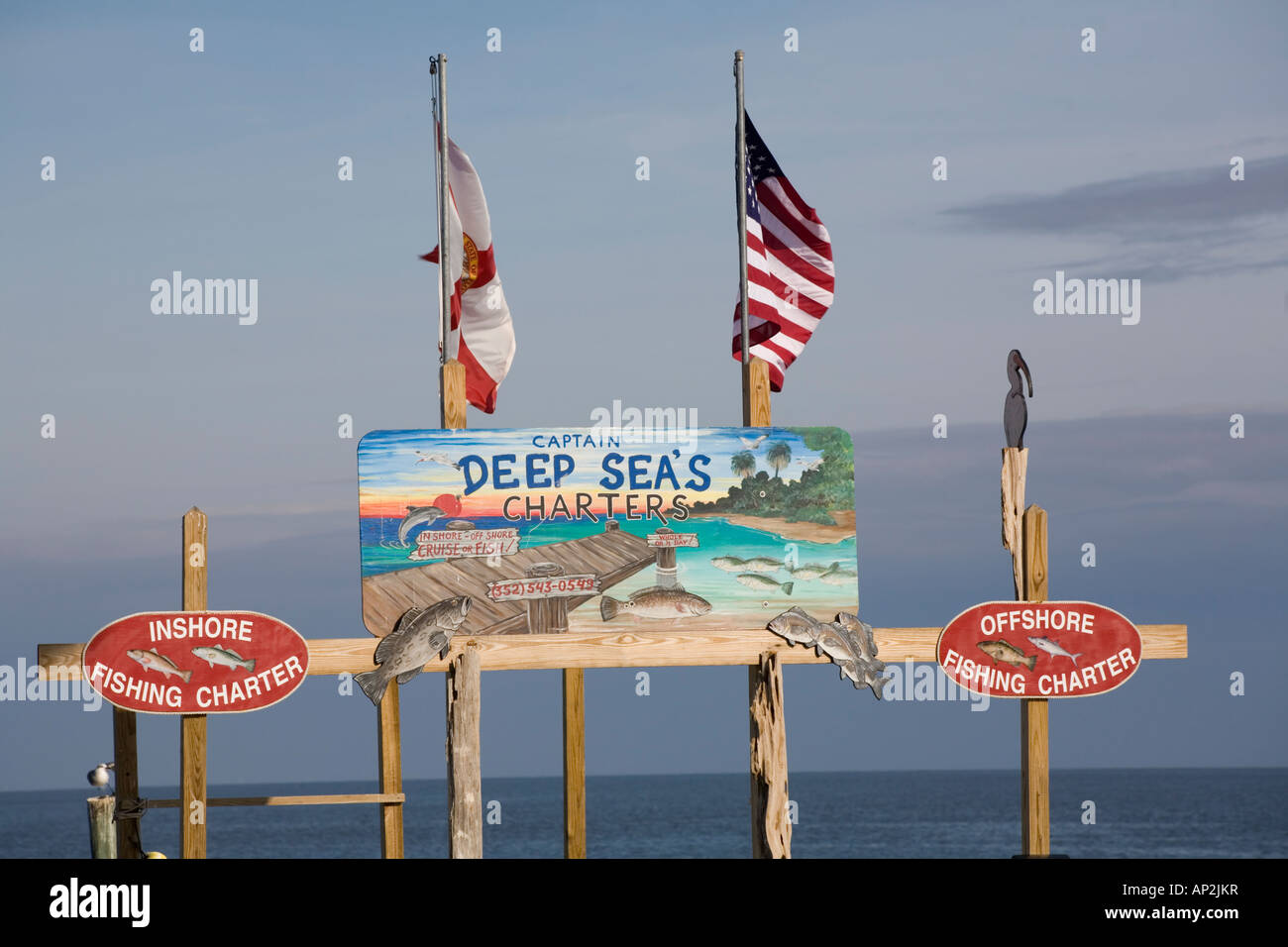 Deep sea fishing charter sign on Cedar key Florida Stock Photo - Alamy