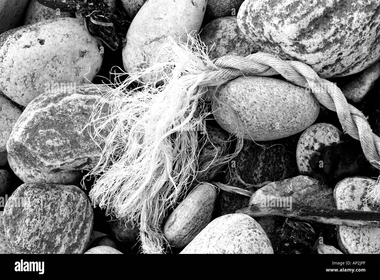 Rope washed up on a pebble beach Stock Photo - Alamy