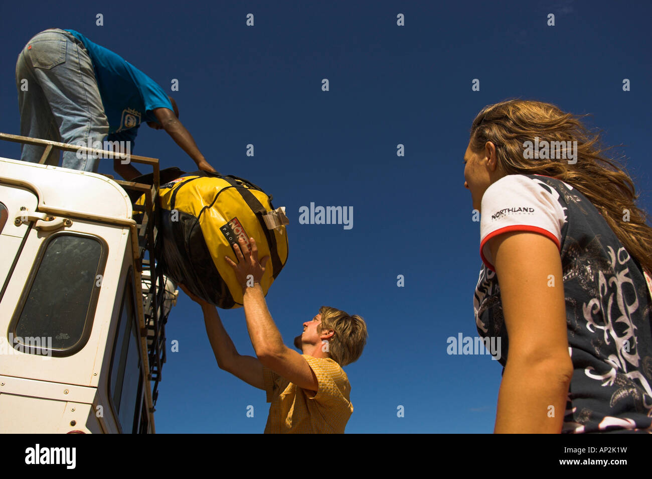 A couple loading a jeep, Adventure, Madagascar, Africa Stock Photo - Alamy