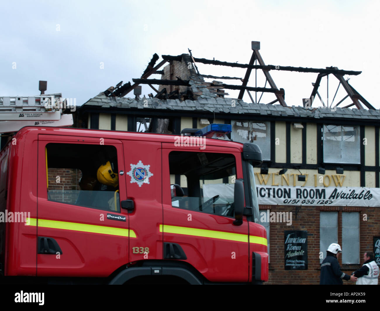 Burnt out building with fire engine in foreground, on the Wirral ...