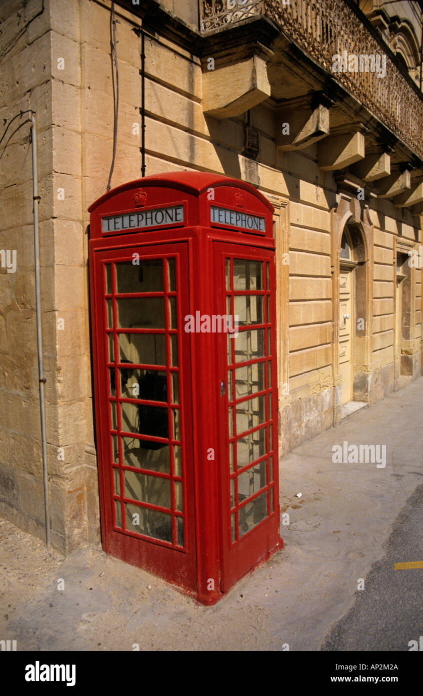 Red telephone box on street corner Victoria Gozo Europe Stock Photo - Alamy