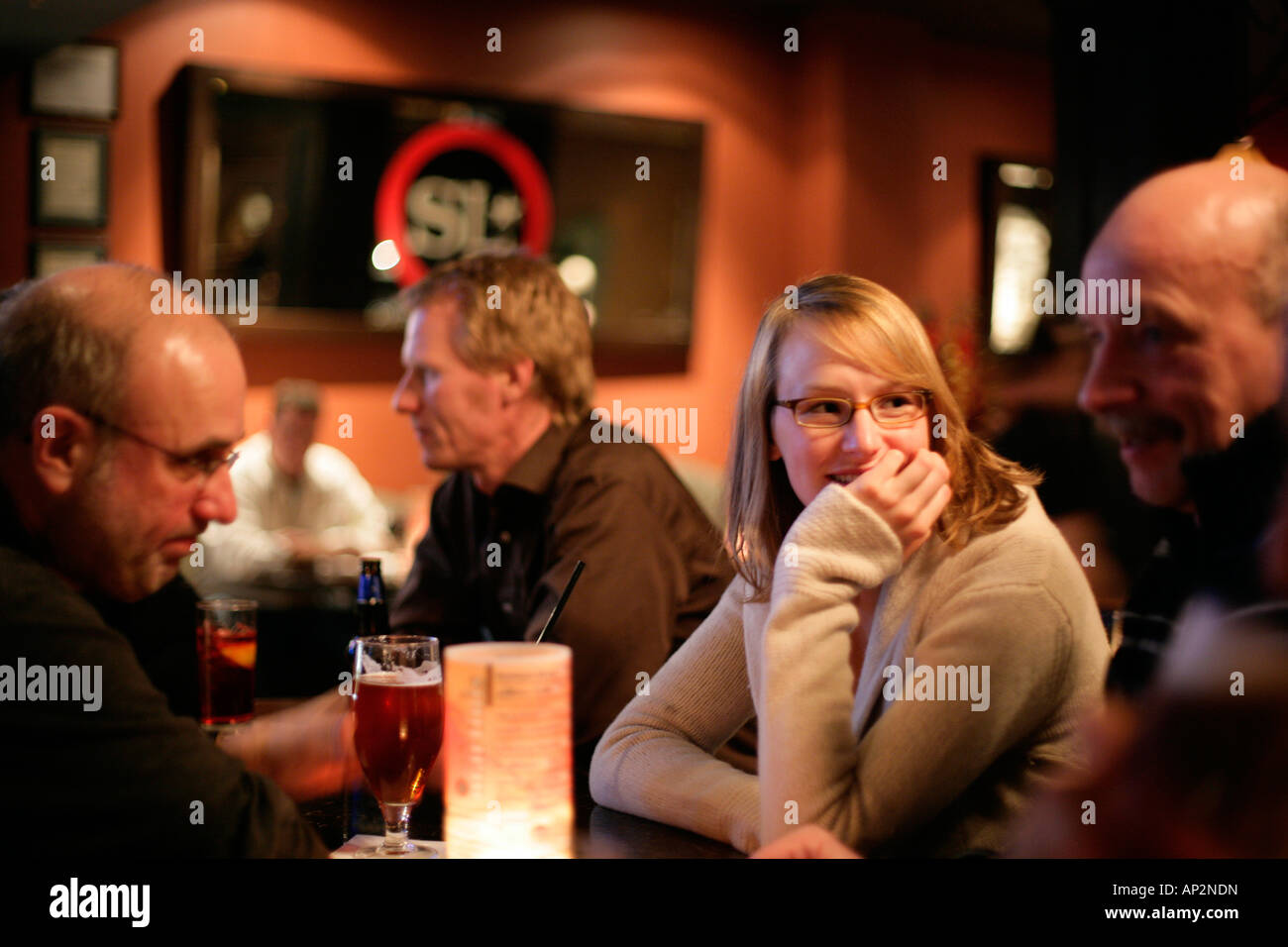 Skiers celebrating in an apres ski bar after skiing, Saltlik, Banff ...