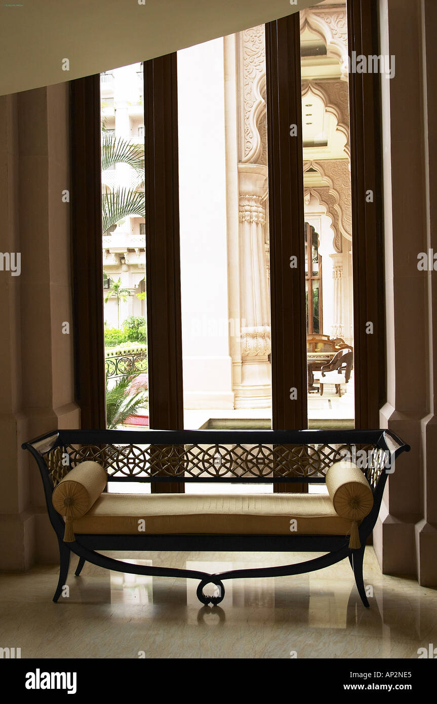 IQP72625 Wooden sofa below huge glass windows Stock Photo - Alamy