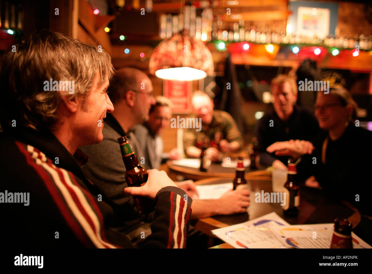 People drinking beer in the T-Bar pub, Castle Mountain ski resort ...