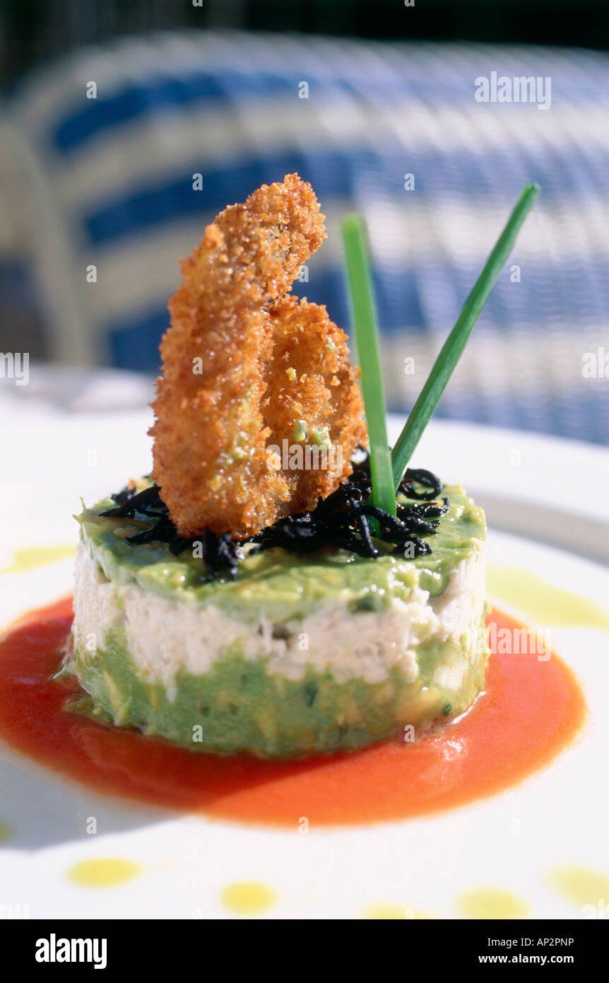 Avocado Guacamole and blue crab salad in spicy tomato coulis with ...