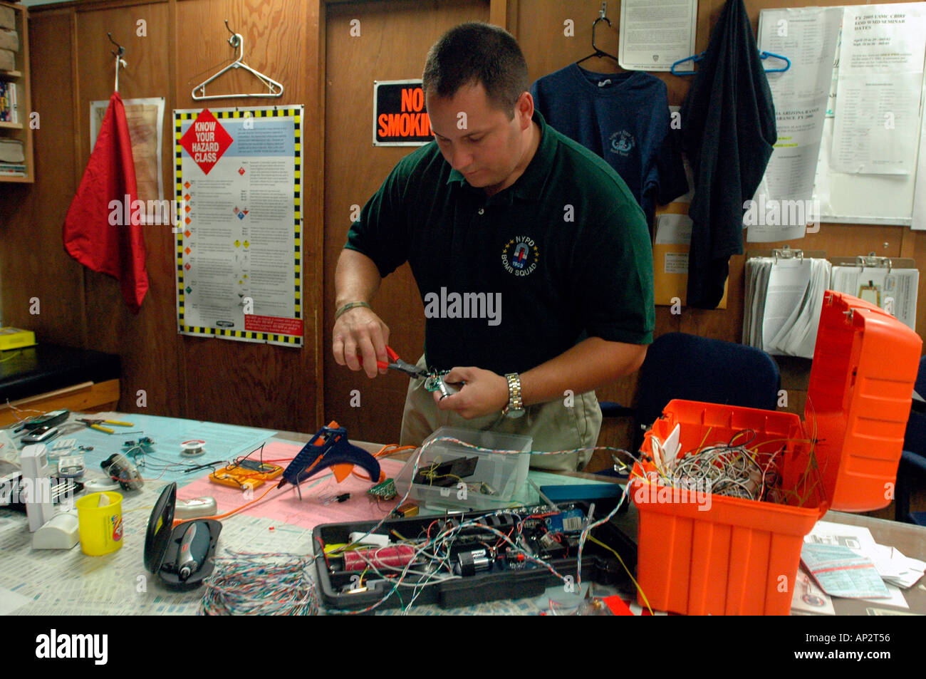 A detective from the NYPD Bomb Squad with materials that might be used ...