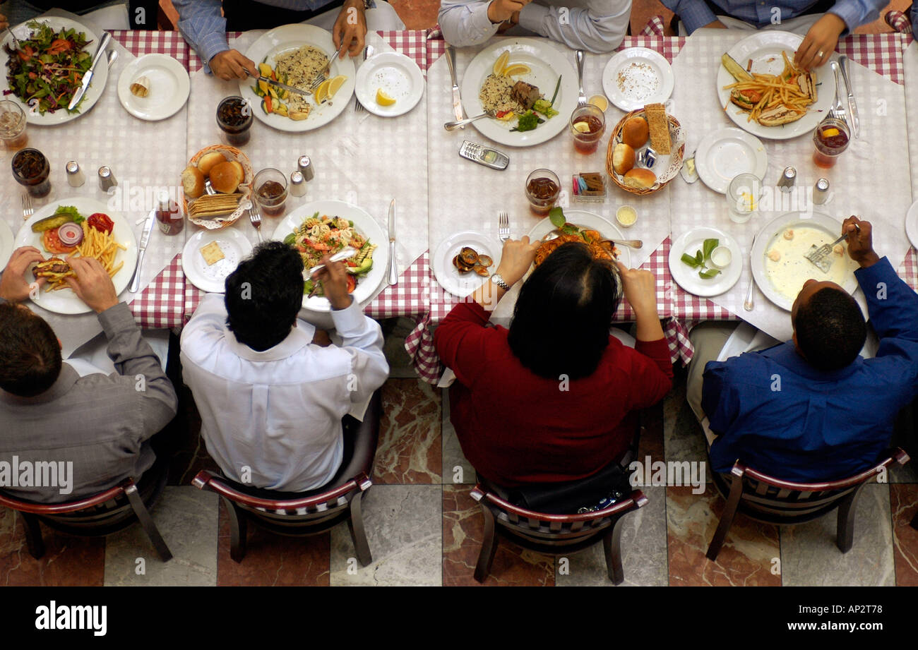 Office workers eat lunch Stock Photo - Alamy