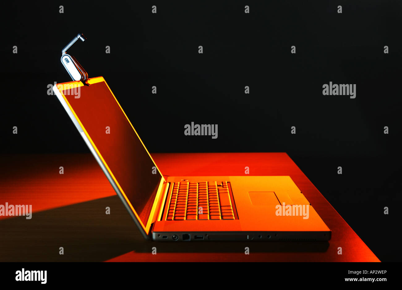 Laptop computer on a desk with light attached Stock Photo - Alamy