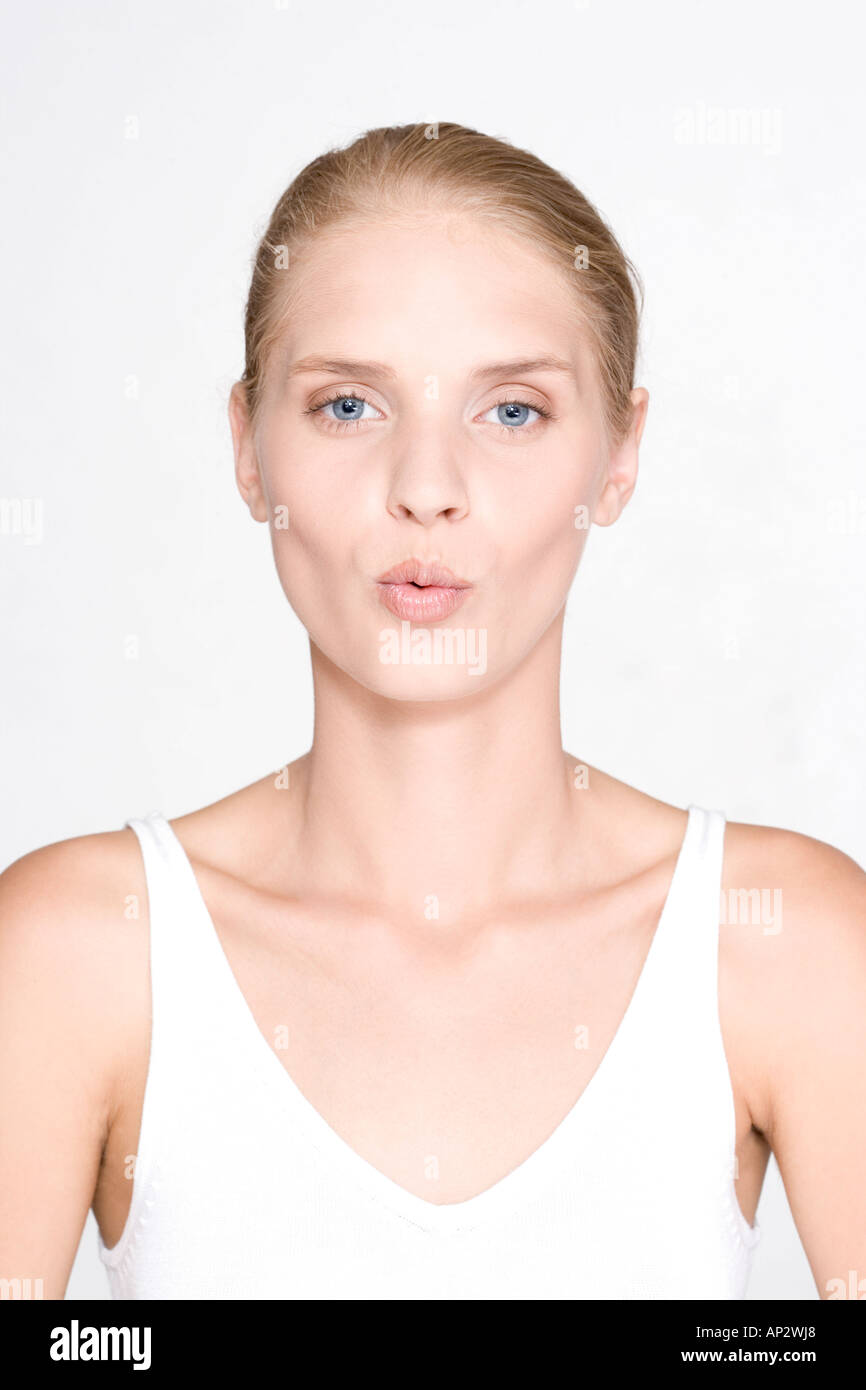 young woman making facial expression Stock Photo - Alamy
