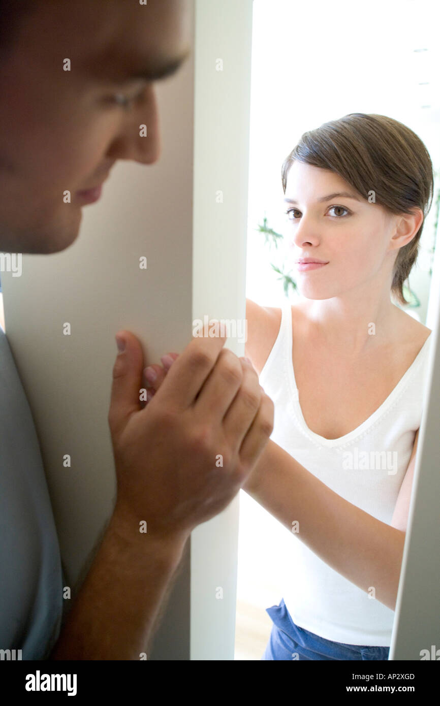 Woman opening door sad hi-res stock photography and images - Alamy