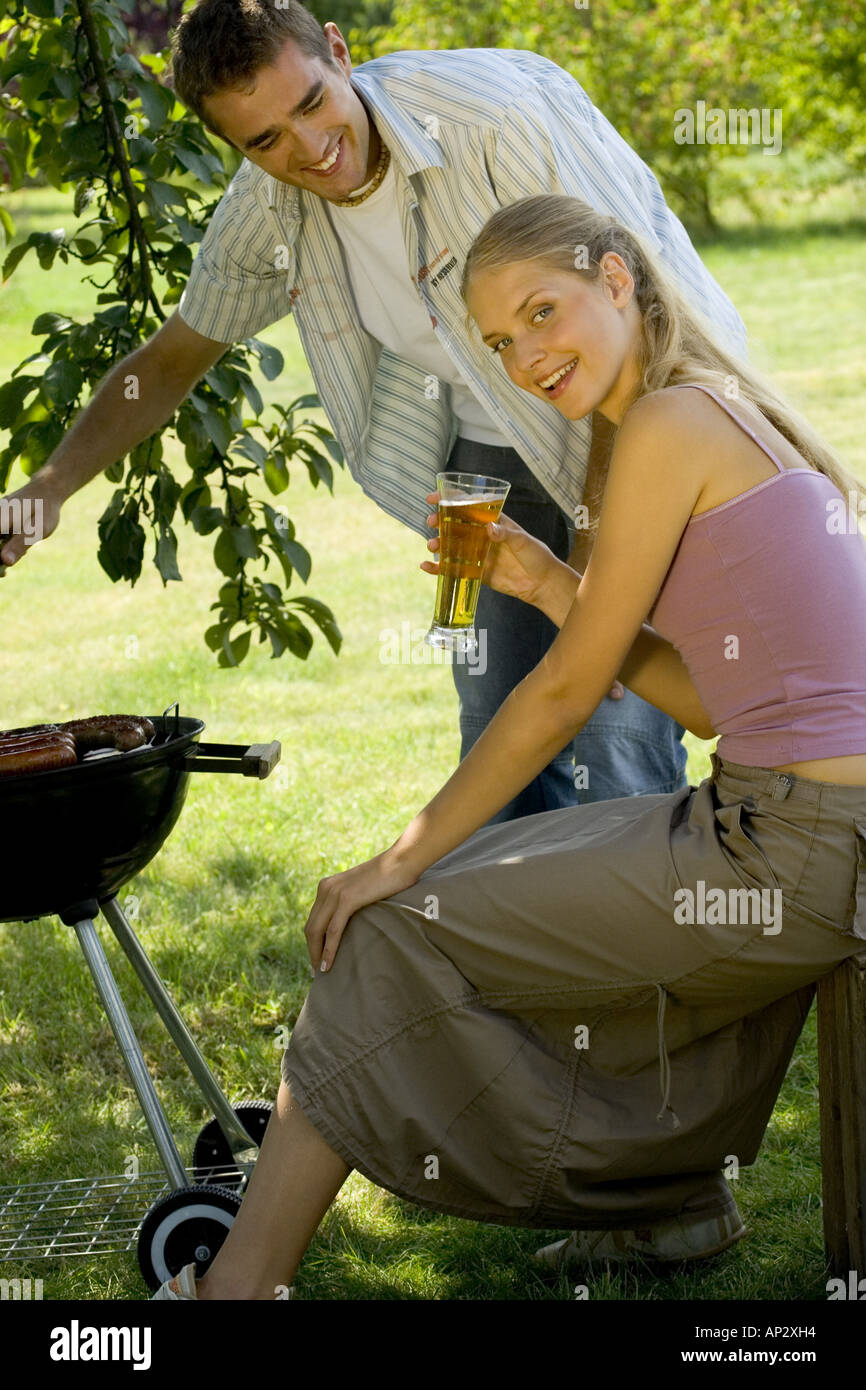 couple having barbecue Stock Photo - Alamy