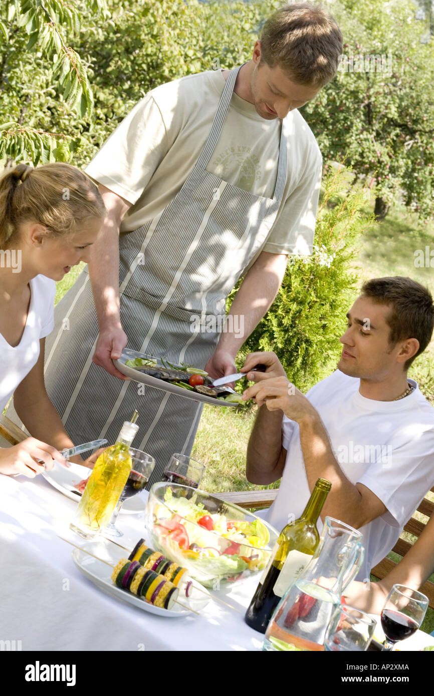 friends having barbecue Stock Photo - Alamy