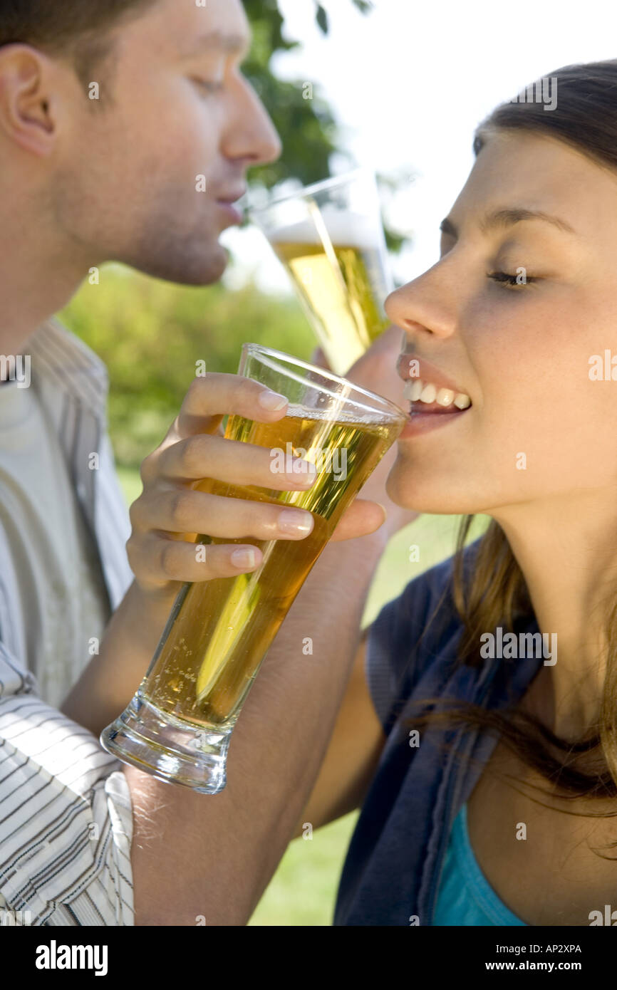 couple drinking beer Stock Photo - Alamy