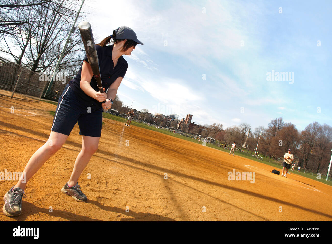 A woman playing softball on Boston Common, Boston, Massachusetts, USA ...