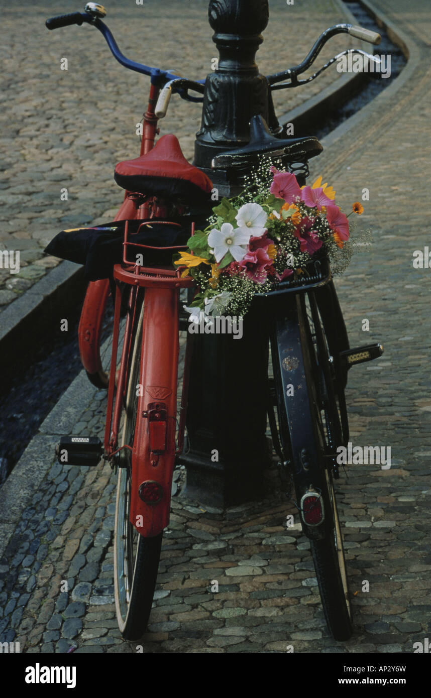 Bicycles with bunch of flowers Stock Photo - Alamy