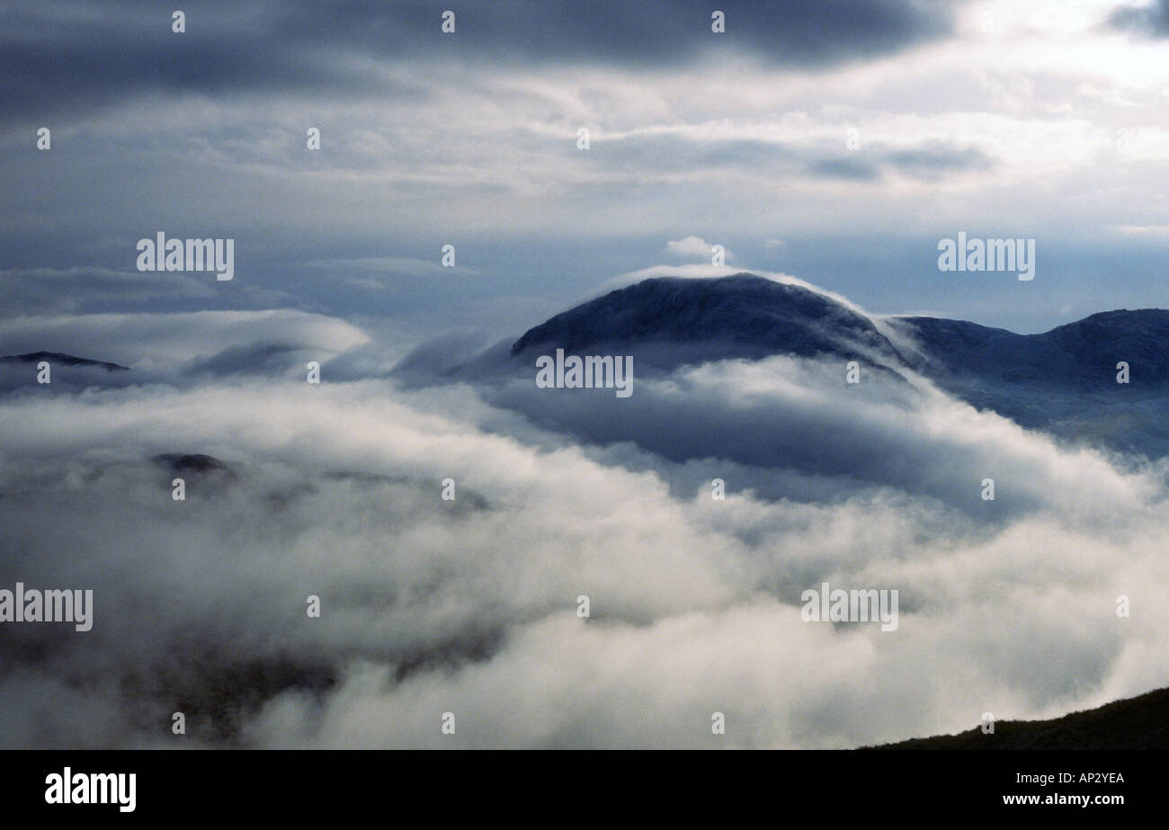 Cloud inversion over the show covered summits of Scafell Scafell Pike ...