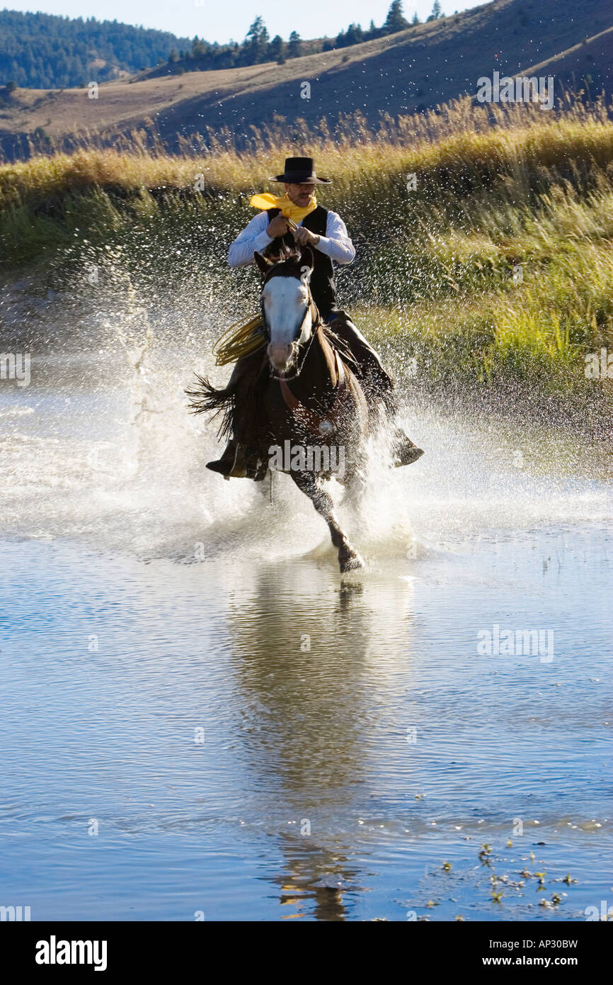 Cowboy riding in water, wildwest, Oregon, USA Stock Photo - Alamy