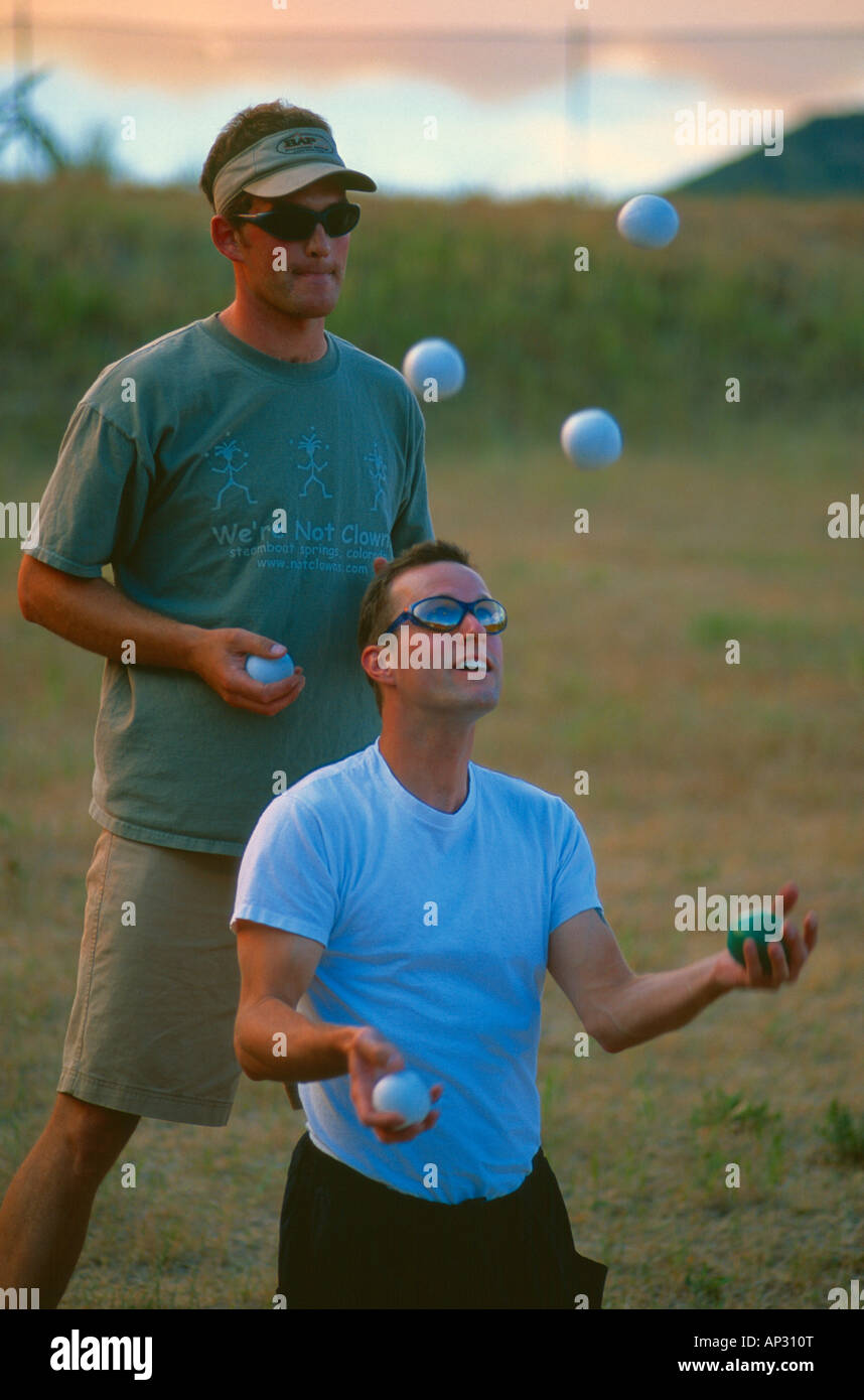 Two young men juggling Stock Photo - Alamy