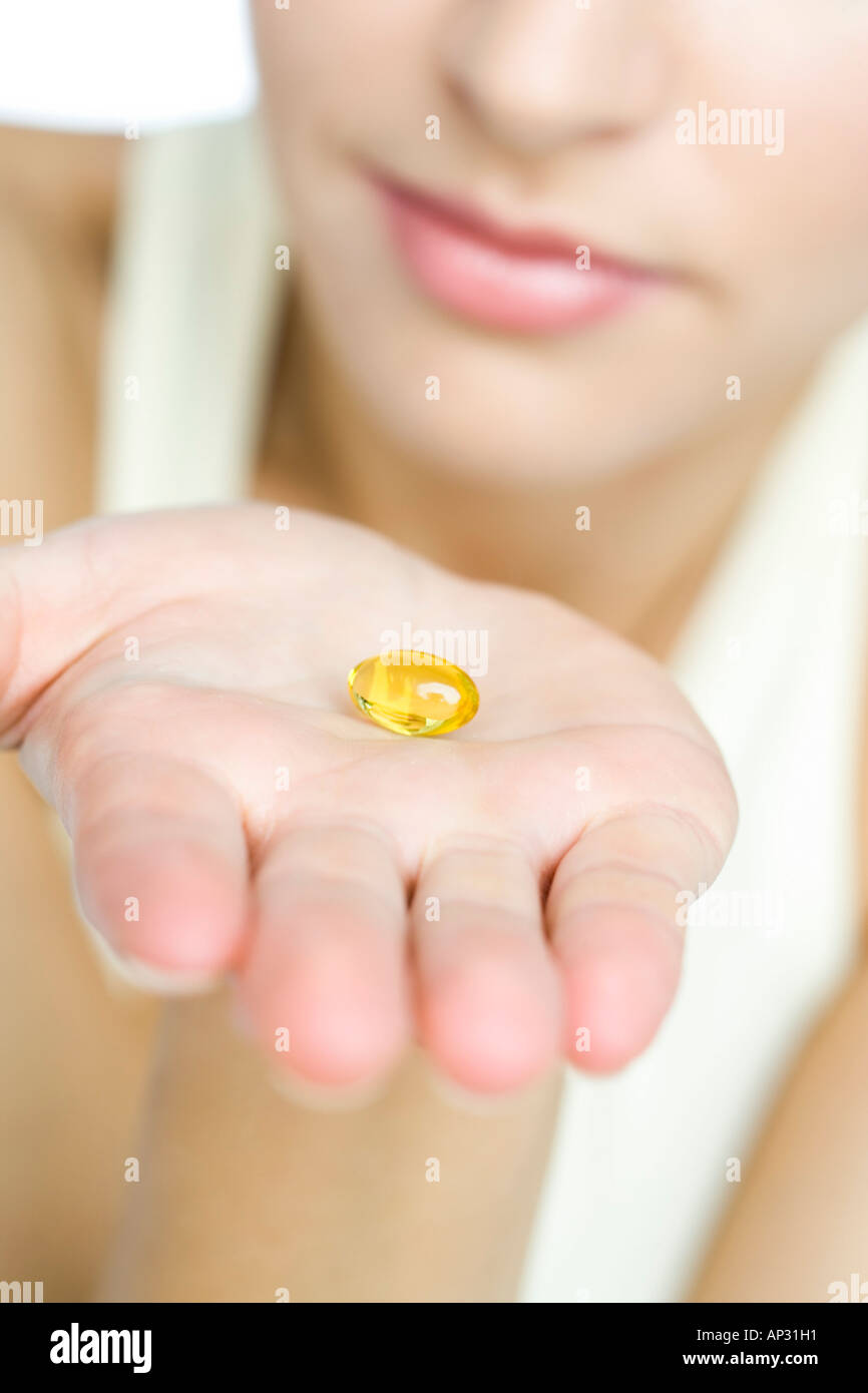 capsule on hand Stock Photo - Alamy
