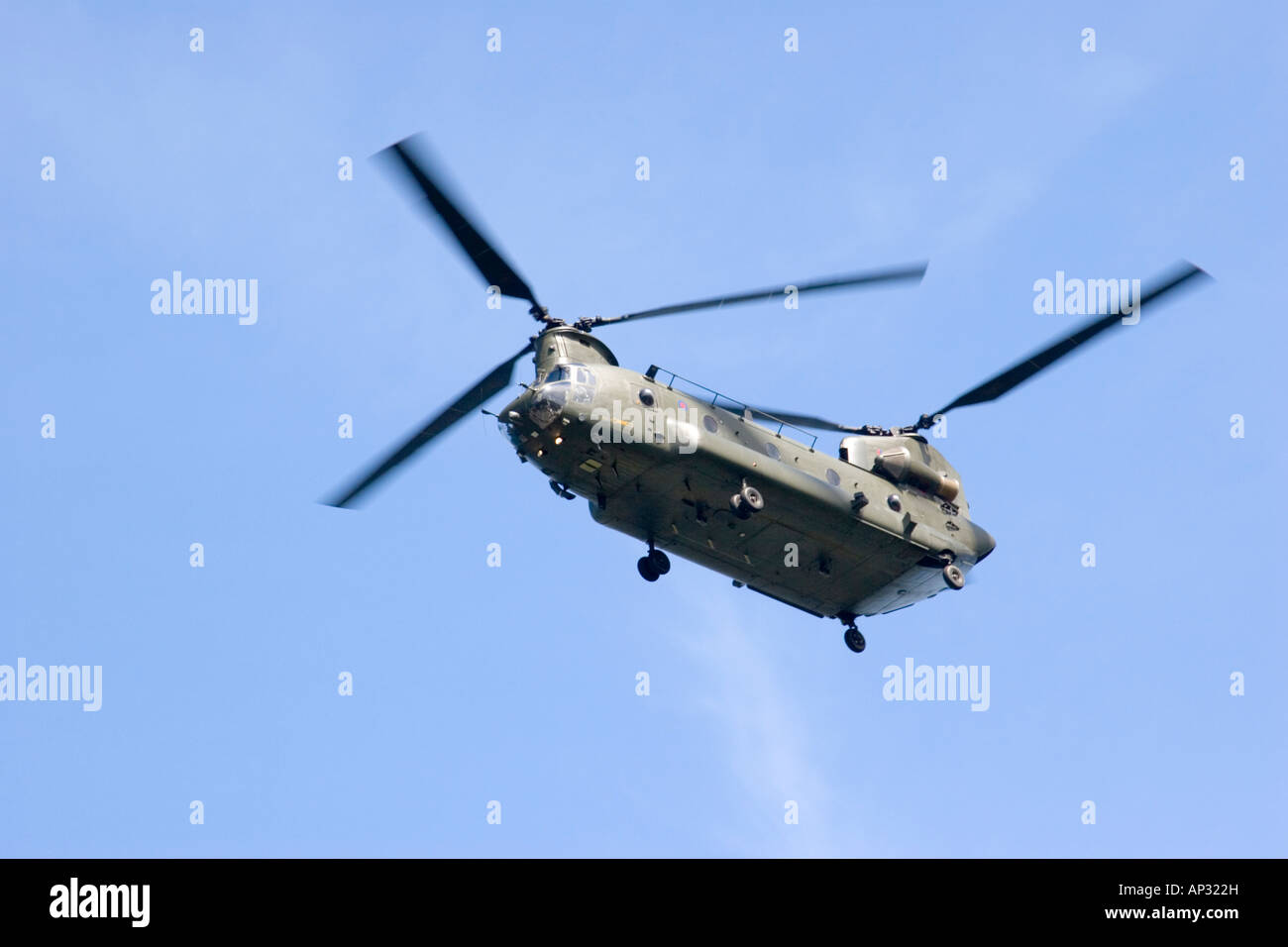 A chinook military helicopter flying directly overhead Stock Photo - Alamy