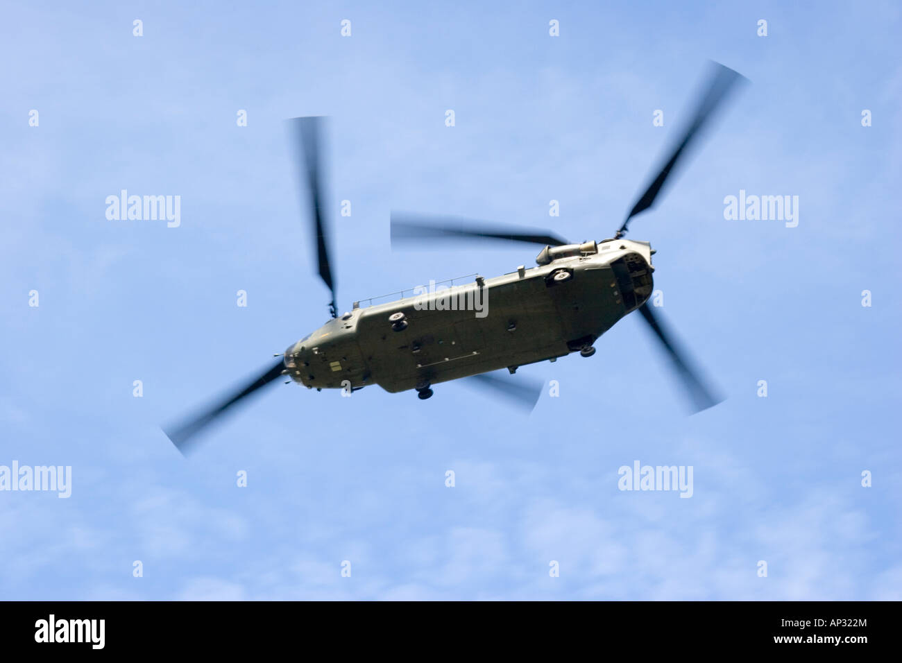 A chinook military helicopter flying directly overhead Stock Photo - Alamy
