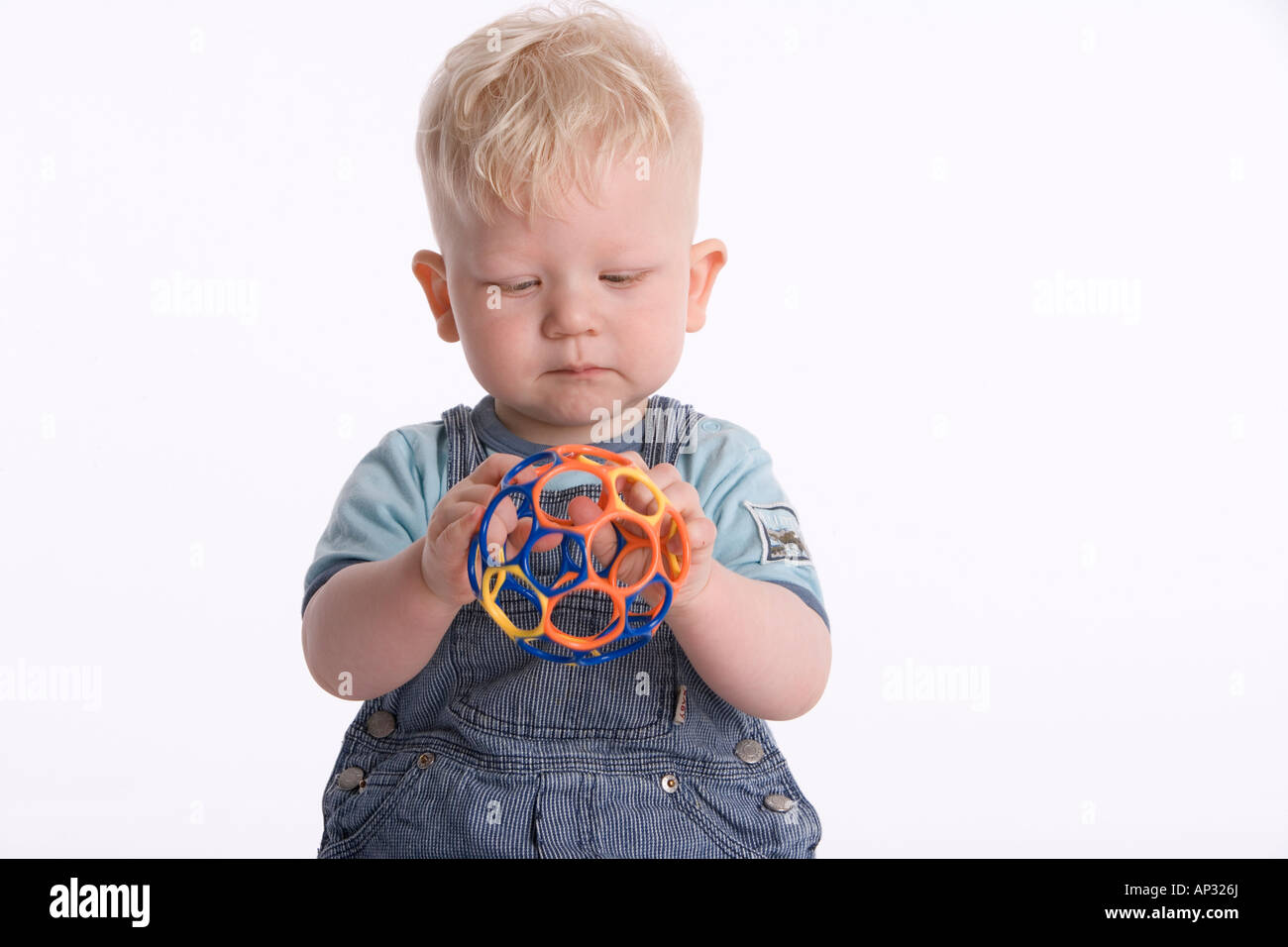 Little boy playing with a ball Stock Photo - Alamy