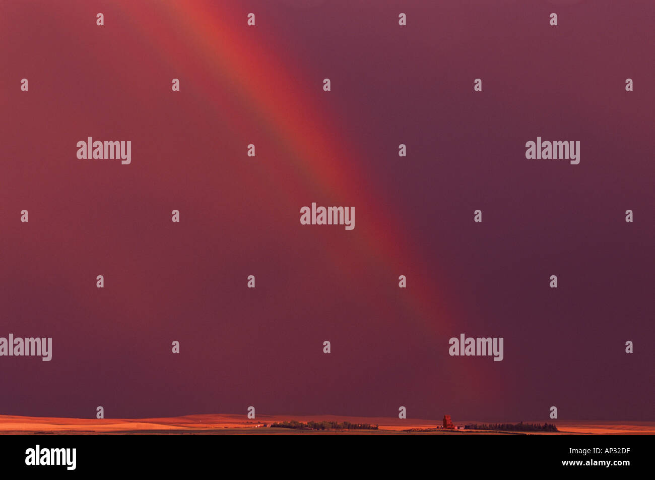 Rainbow in red sky Stock Photo - Alamy