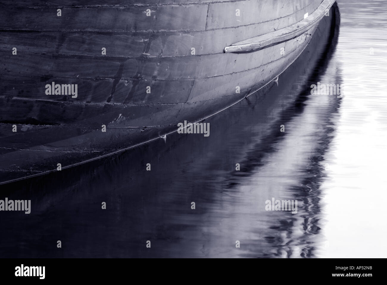 Boat reflections in lake Stock Photo - Alamy