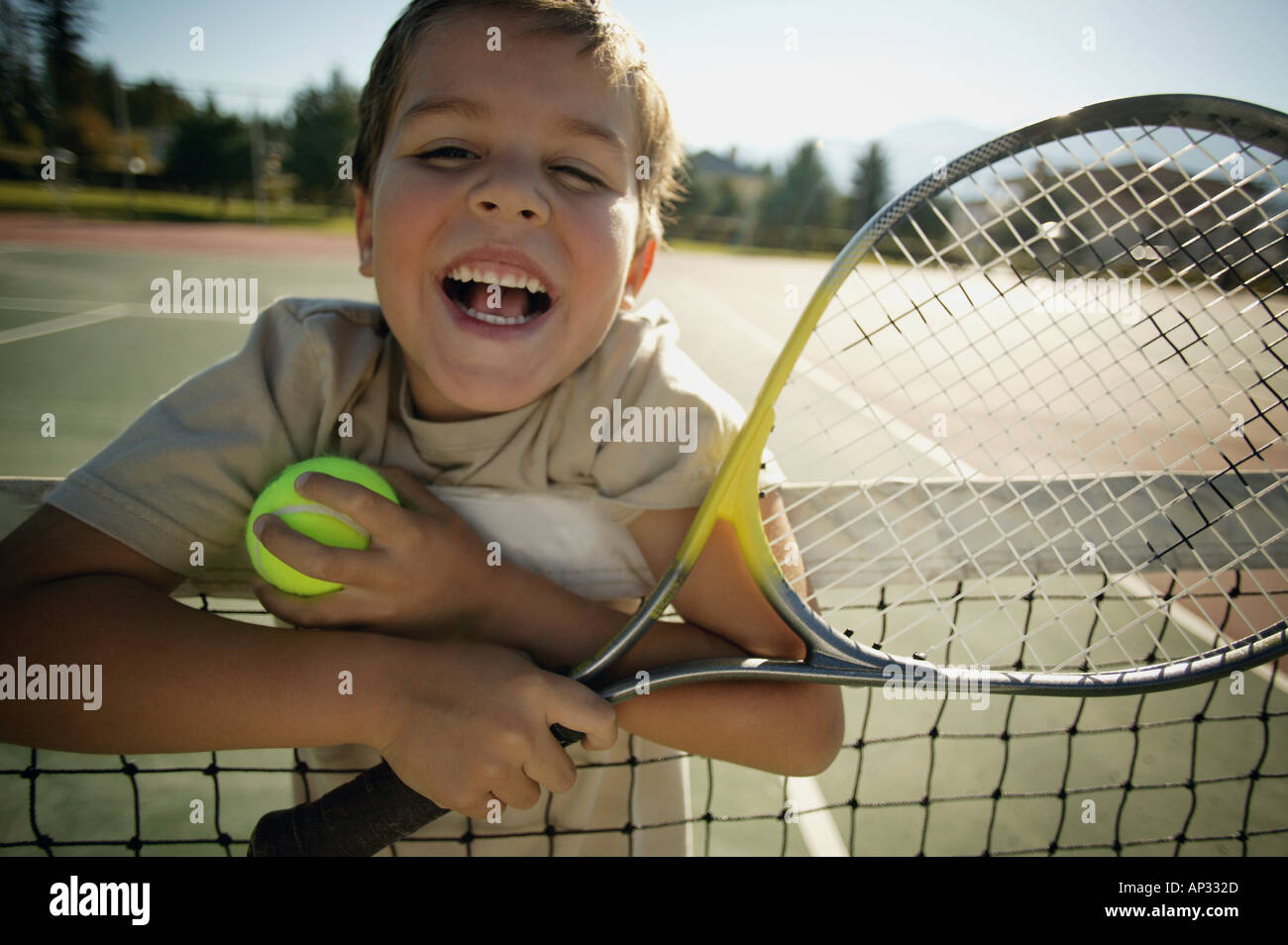 Boy with tennis racket Stock Photo - Alamy