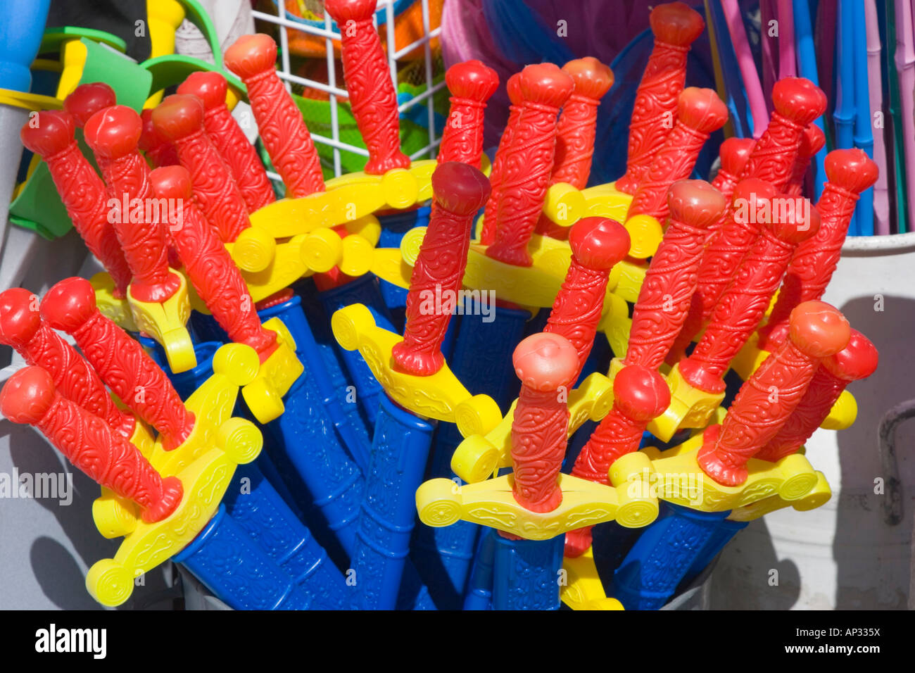 Plastic Excalibur swords for sale in a toy shop Stock Photo - Alamy
