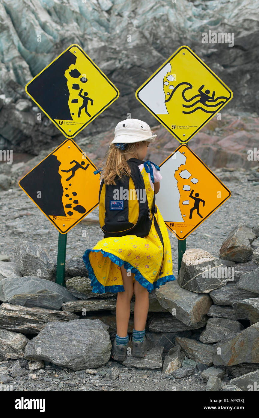 Girl watching warning signs, hiking at Franz Josef Glacier, Westland ...