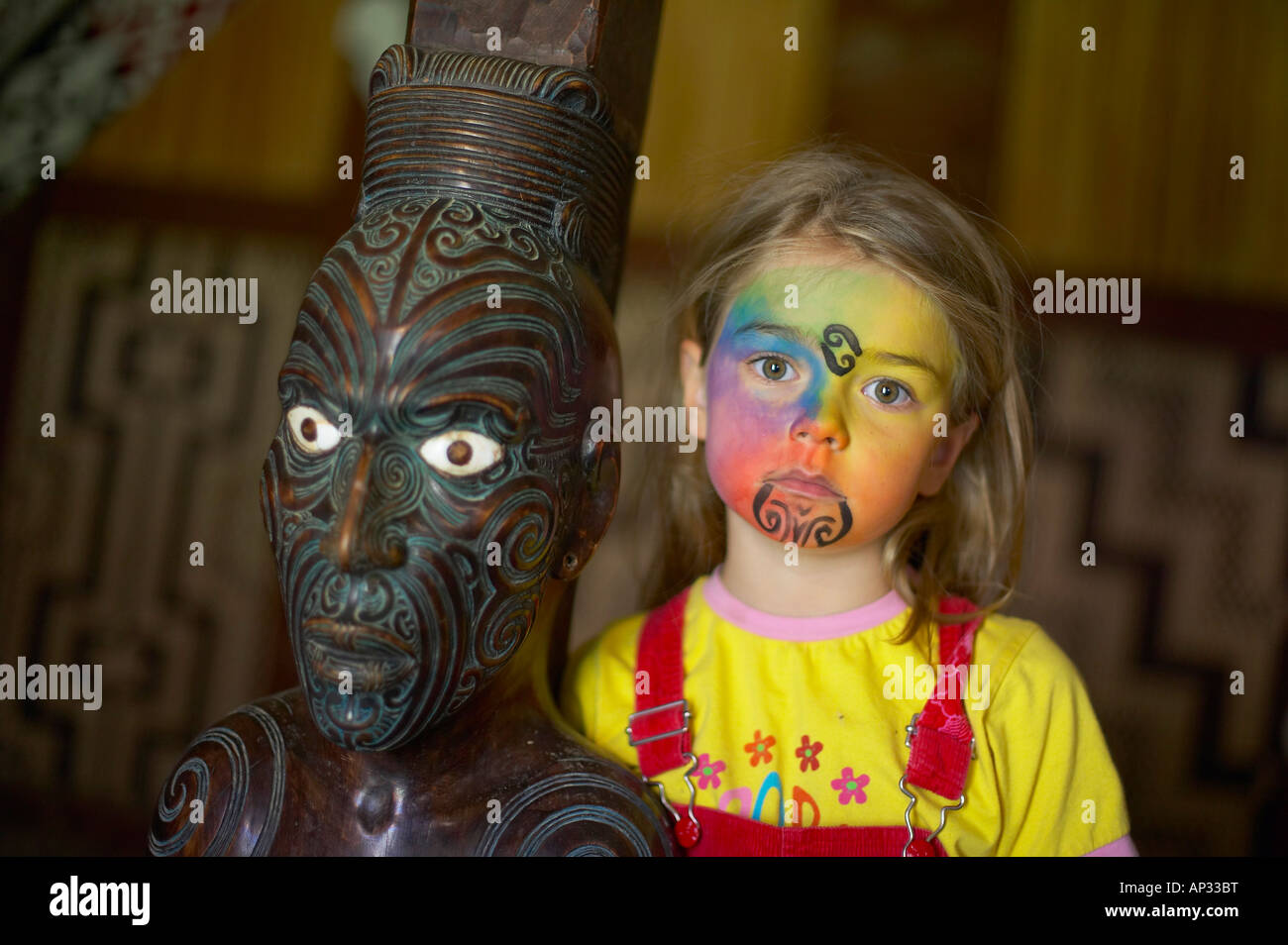 Girl with facepainting (like a Maori Moko, Tatoo), wooden Maori ...