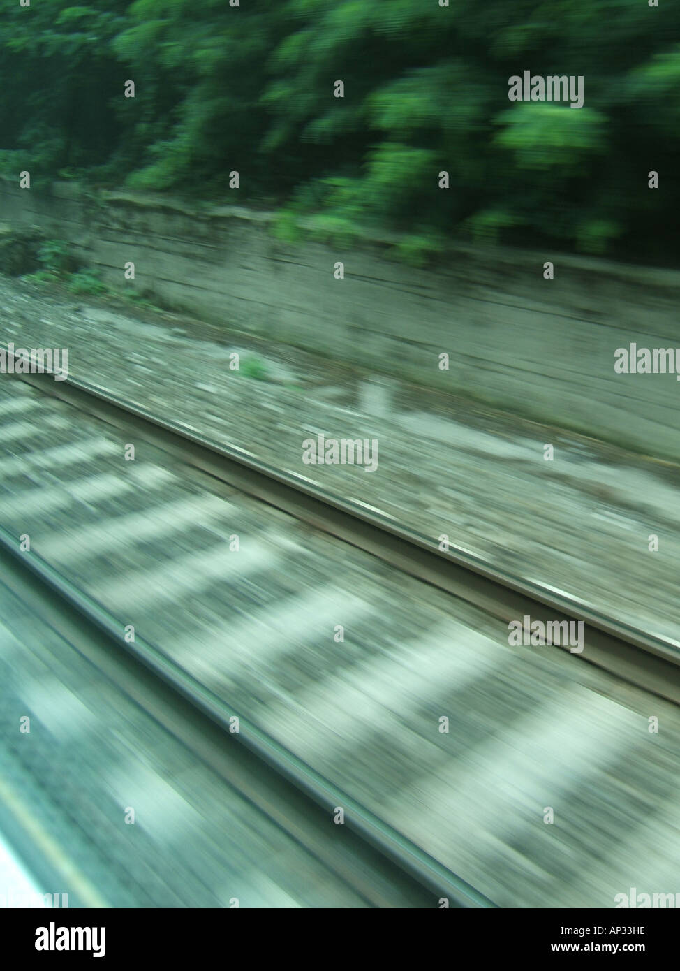 view of train tracks sleepers from fast train window Stock Photo - Alamy